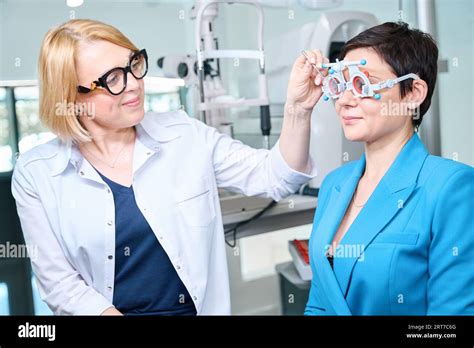 Ophthalmologist Performing Monocular Subjective Refraction Test In