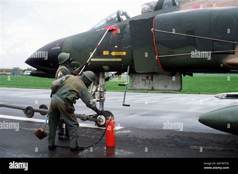 British Royal Air Force Members Decontaminate An F C Phantom Ii Aircraft During Chemical Warfare