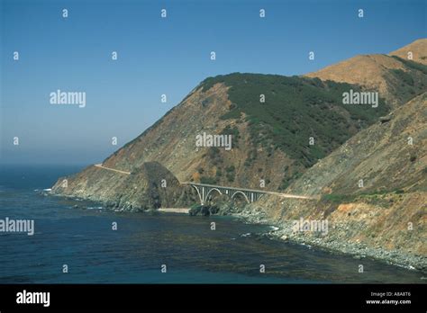 Steep Coastal Hills And Cliffs Above Bridge Along Highway One Big Sur