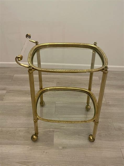 Glamorous Oval Brass And Glass Two Tier Bar Cart With Schnazzy Lucite