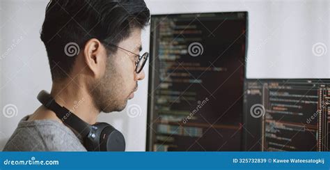 Asian Male Software Developer Coding Program On Desktop Computer Man