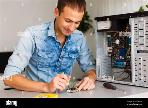 Man Fixing A Computer Stock Photo Alamy