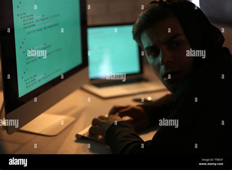 Hacker With Computer And Laptop Stock Photo Alamy