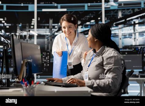 Teamworking Colleagues In Server Hub Pleased After Successful