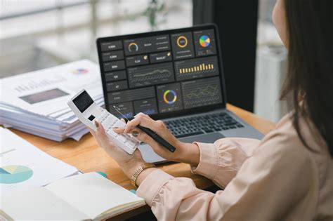 Premium Photo The Female Analyst Utilizes A Computer And A Dashboard For Business Data Analyze