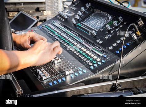 Hand Adjusting On A Professional Audio Mixer Stock Photo Alamy