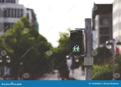 A Pedestrian Traffic Light Shows A Green Graphic Of A Symbolic Different Sex Loving Couple At A