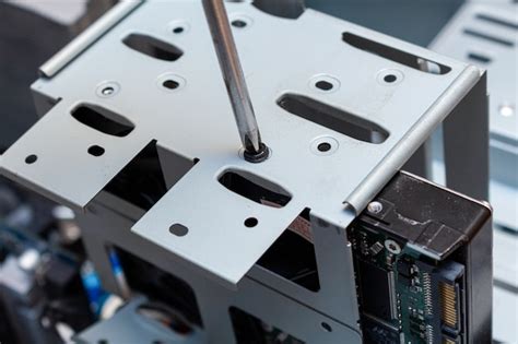 Premium Photo Screwing Installing Upgrading Hdd Drive Disk On A Place In The Service