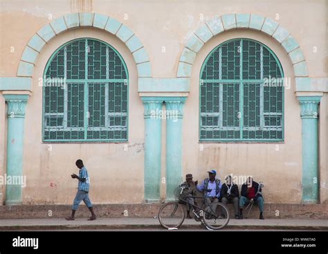 Eritrean People In Front Of A Building From The Italian Colonial Times Near The Mosque Central