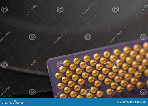 The Microprocessor Processor Of The Cpu Of A Computer Or Laptop Lies On A Dark Matte Surface