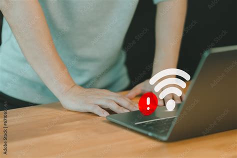 man using a laptop computer to connect to wifi but wifi not connected