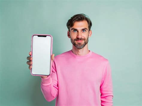 A Man Is Holding A Mobile Phone And Showing A Blank White Screen