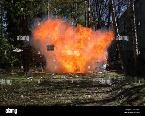 Fire From A Large Explosion Between Green Trees Stock Photo Alamy