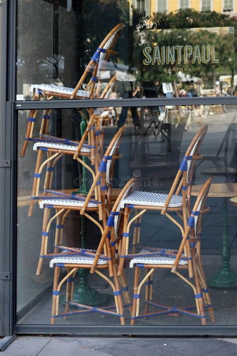 Chairs Stacked On Top Of Each Other In The Window Of A Closed Restaurant Editorial Image Image
