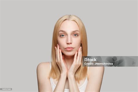 Portrait Of Healthy Blonde Woman With Straight Blond Hair And Clean