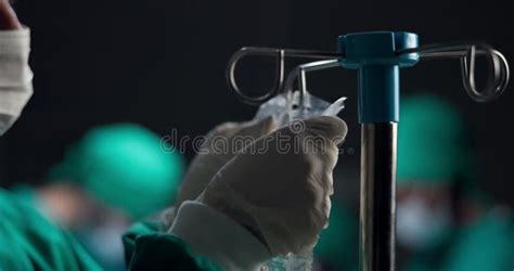 Hands Iv Drip And Surgery With Doctor In Hospital Getting Ready For