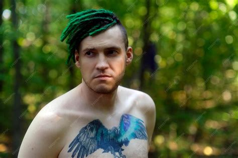Premium Photo Young Naked Man With Green Dreadlocks Tattoo On Chest