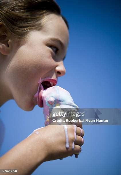 Girl Eating Messy Ice Cream Cone Photos And Premium High Res Pictures