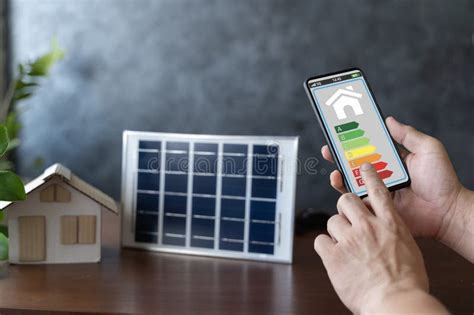 Smart Home Display And Model House With Solar Panel Energy Efficient Technology Concept Energy