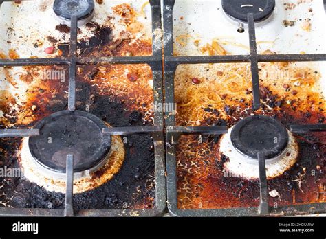Dirty Gas Stove Surface Two Gas Burners And Cast Iron Grate Of A Gas