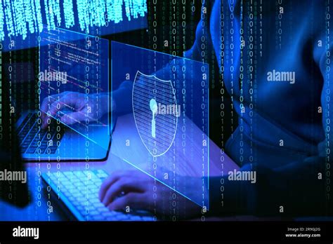 cyber attack hacker working with computers in dark room closeup