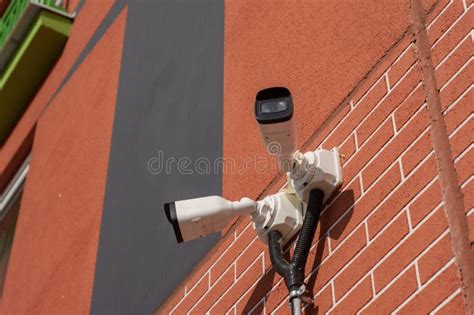 Cctv Camera On The Wall Of A Residential Building For Surveillance And