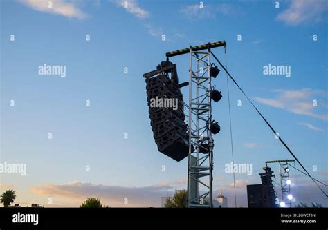 Line Array Speaker System Hanging From Pole During Daylight Performance