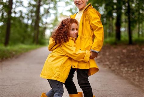 Premium Photo Ginger Sister Hugging Brother In Park