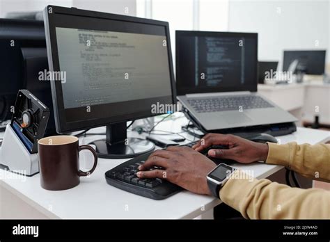 Hands Of Young Male Programmer Or It Engineer Decoding Data On Computer