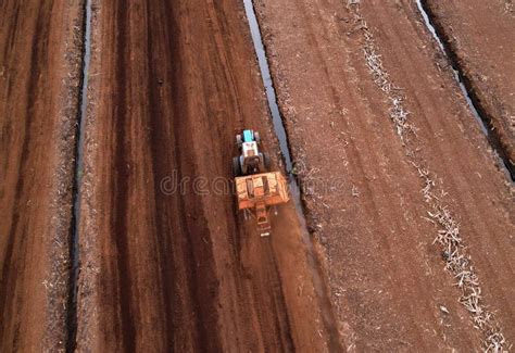 Peat Harvester Tractor On Collecting Extracting Peat Mining And Harvesting Peatland Area