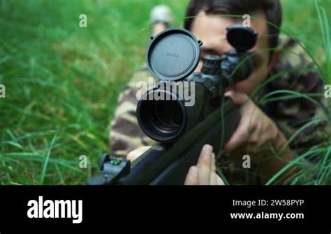 Male Sniper Looking Through The Scope Of His Sniper Rifle Stock Video Footage Alamy