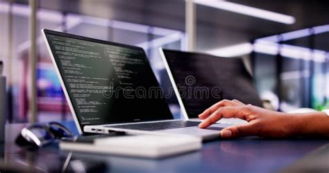 Multi Tasking African American Woman Coding Website On Laptop At Office