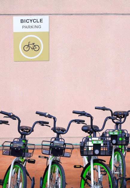 Premium Photo | Row of bikes parked in bicycle parking area outside of ...