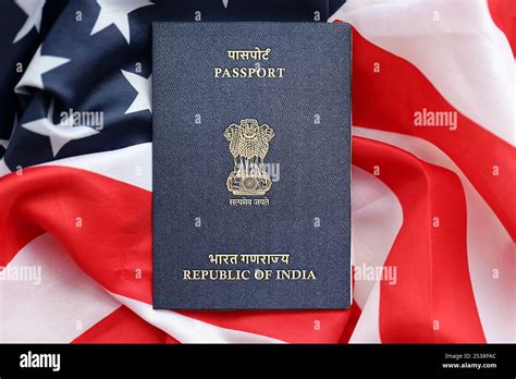 Blue Indian Passport On United States National Flag Background Close Up