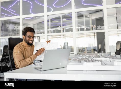 Architect Demonstrating His Project On An Online Tutorial And Looking