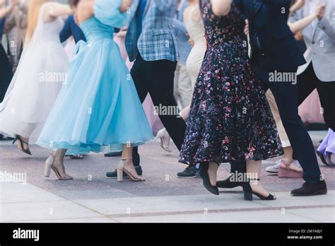 High School Graduates Dancing Waltz And Classical Ball Dance In Dresses