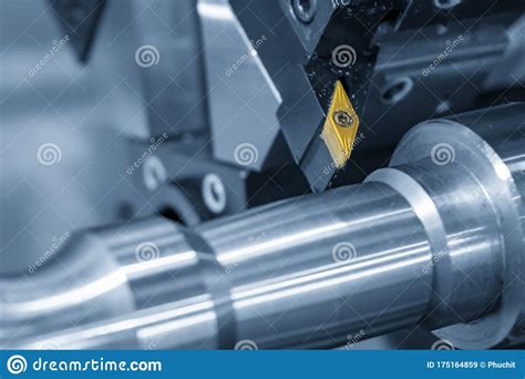 The CNC Lathe Machine In Metal Working Process Forming Cutting The Metal Shaft Parts With In The