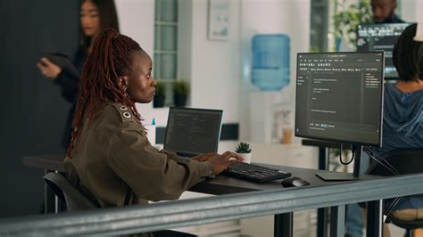 Premium Photo African American Coder Writing Programming Language On Computer To Develop New