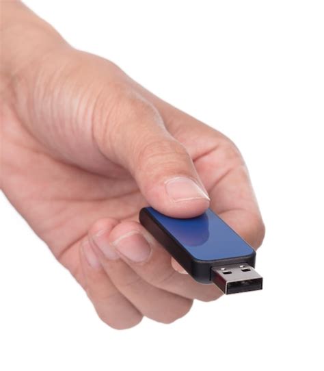 Premium Photo Hand Holding Blue Usb Flash Memory Isolated On A White