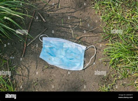 Used Surgical Mask Abandoned On Path Stock Photo Alamy