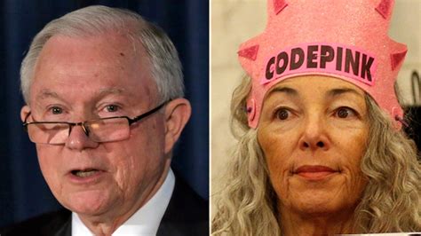 Justice Department Drops Case Against Code Pink Protester Who Laughed