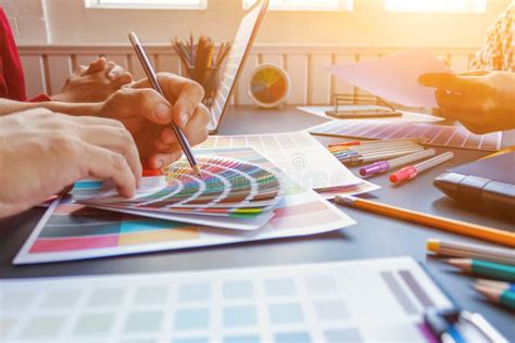 A Team Of Web Designers Are Working Together To Develop A Mobile Responsive Website With Ui Ux