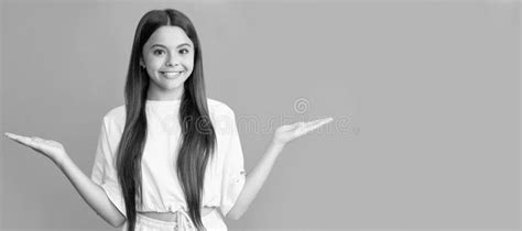 Happy Teen Girl Presenting Product Making Choice On Blue Background With Copy Space Choice