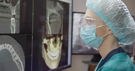 Radiologist Dentist Doctor Looking At Teeth 3d X Ray On Desktop
