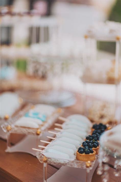 Wedding Candy Bar Delicious Desserts With Fruits Macarons Cakes And Cookies On Table At