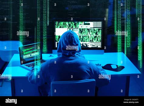 Easily Breaching Through Your Firewall Rearview Shot Of A Male Hacker
