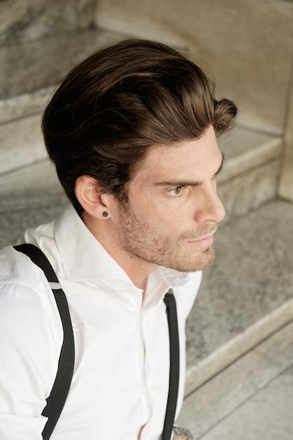 Premium Photo Handsome Man Sitting On Steps