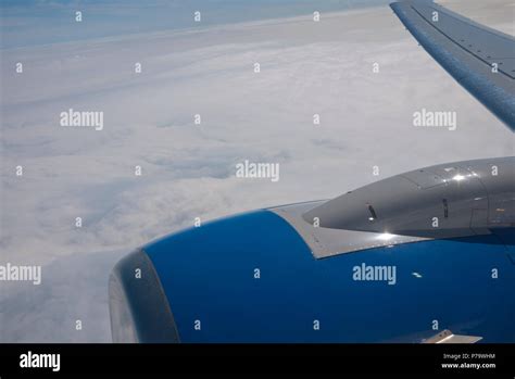 Wing And Jet Engine Of A Boeing 737 Jet 2 Passenger Aircraft Flying Somewhere Over The English