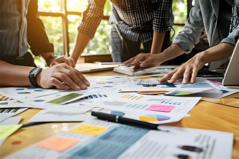 Team Collaborates On Data Analysis Charts And Graphs For Project Success Strategically Business