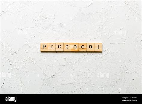 Protocol Word Written On Wood Block Protocol Text On Cement Table For